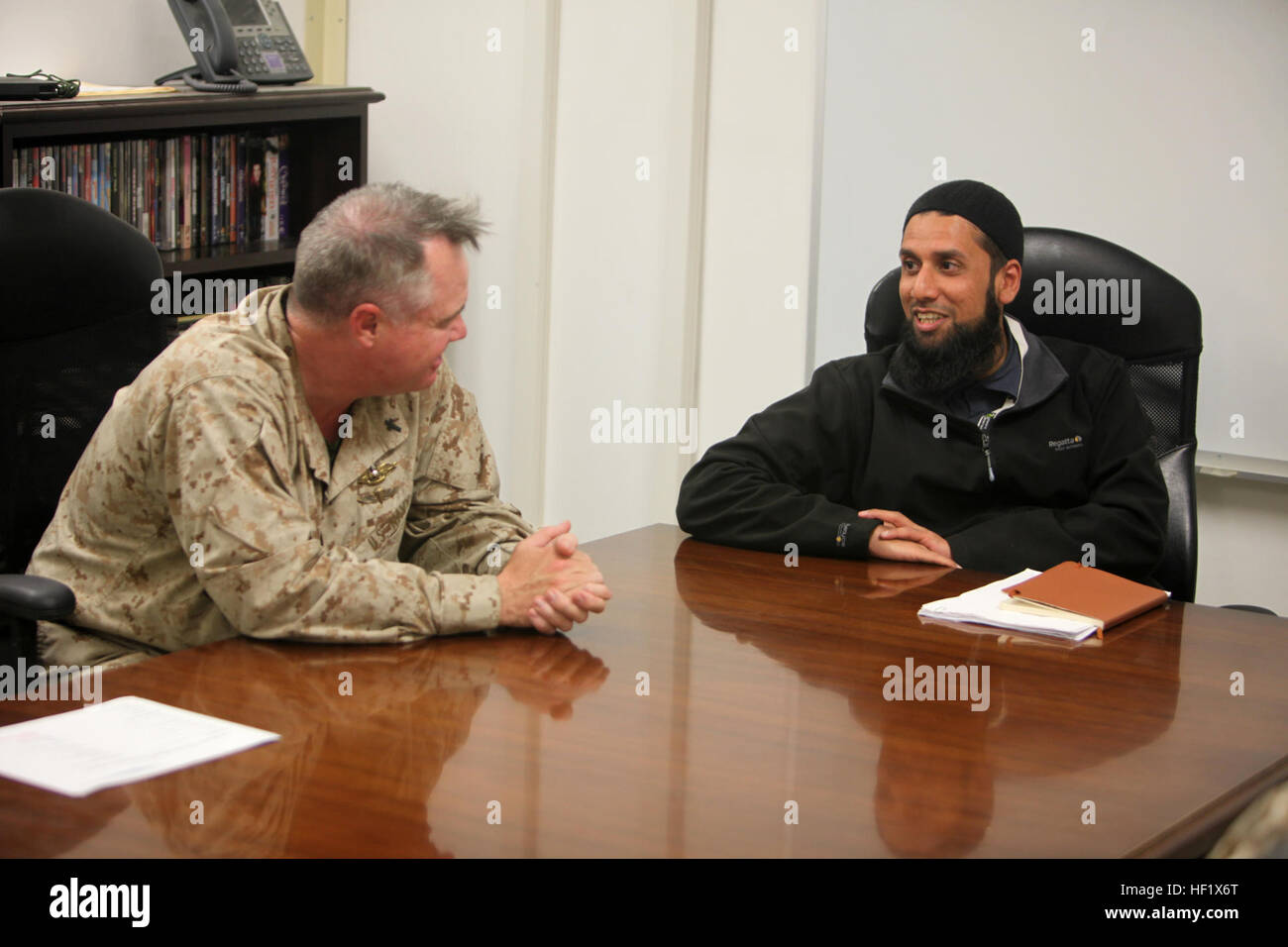 Imam Asim Hafiz, right, an Islamic religious advisor with the British ...