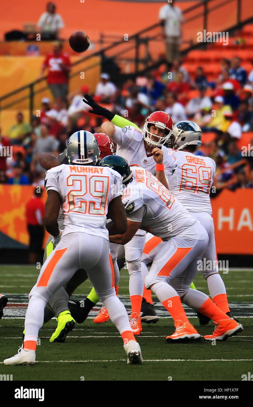 Alex Smith (center), quarterback for the Kansas City Chiefs, throws the ...