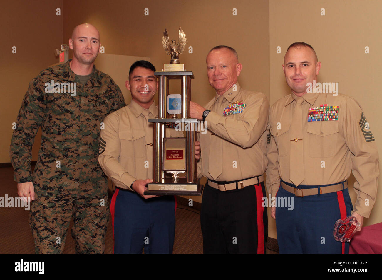 Marines with 1st Marine Division display the Inchon Trophy, which was ...