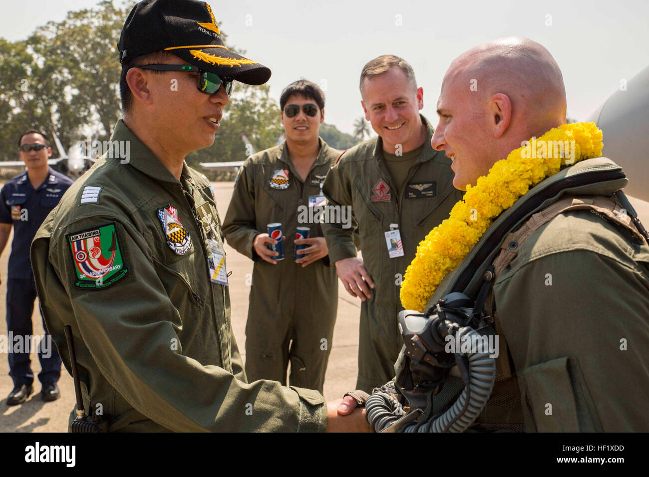Group Captain Narong Intachat, left, welcomes Capt. Timothy Barchett to ...