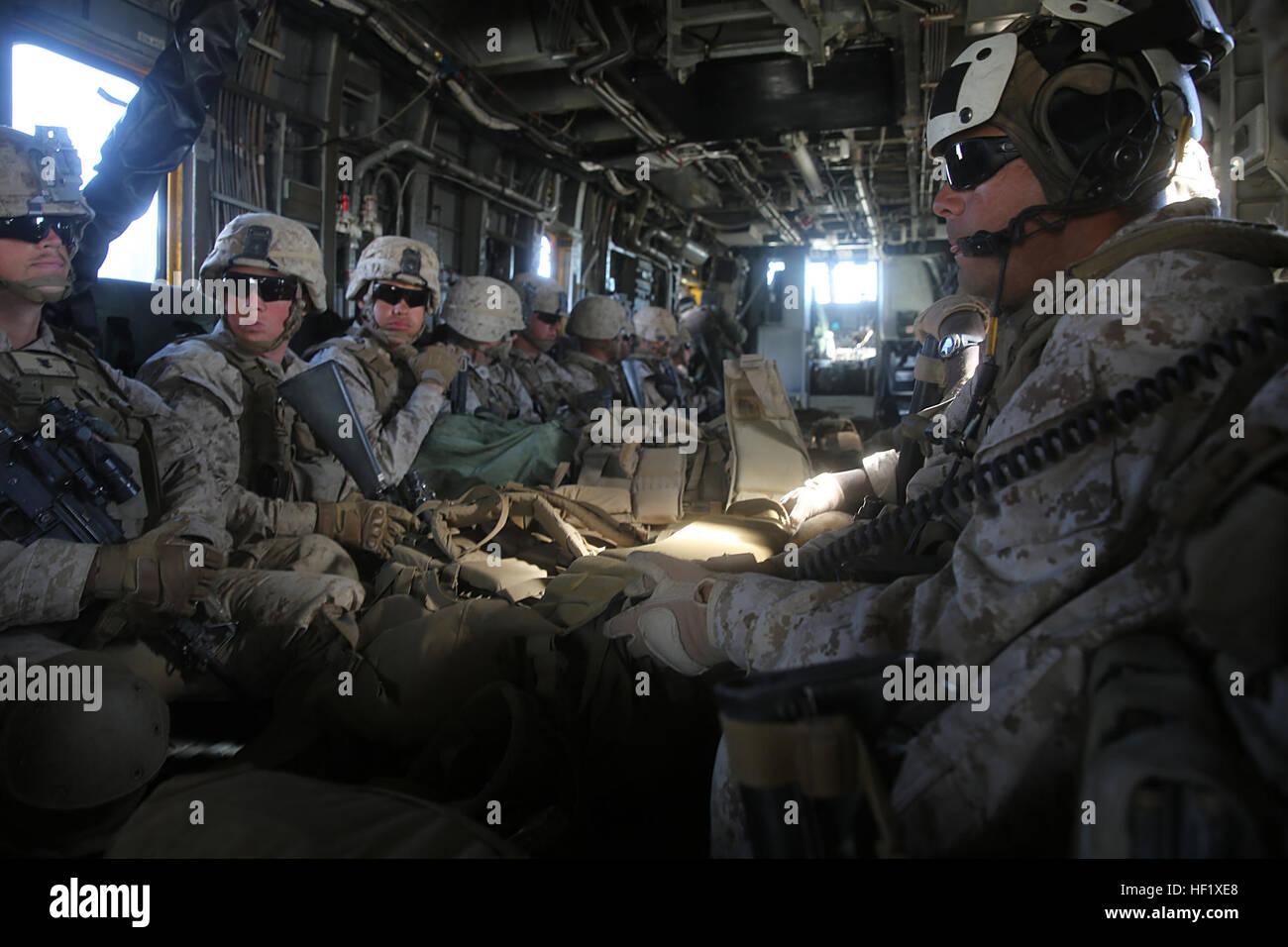 Marines with Bravo Company, 1st Battalion, 7th Marine Regiment, wait inside a CH-53E super sea ...