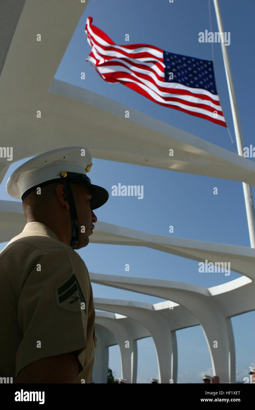 A Marine stands at attention inside the USS Arizona Memorial during a ...