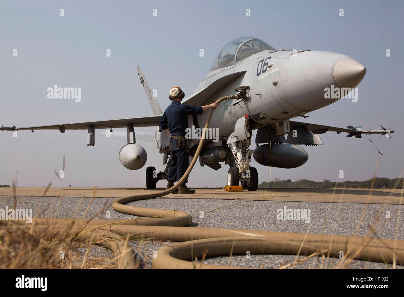 Cpl. James George refuels an FA-18D Hornet at Wing One Royal Thai Air ...