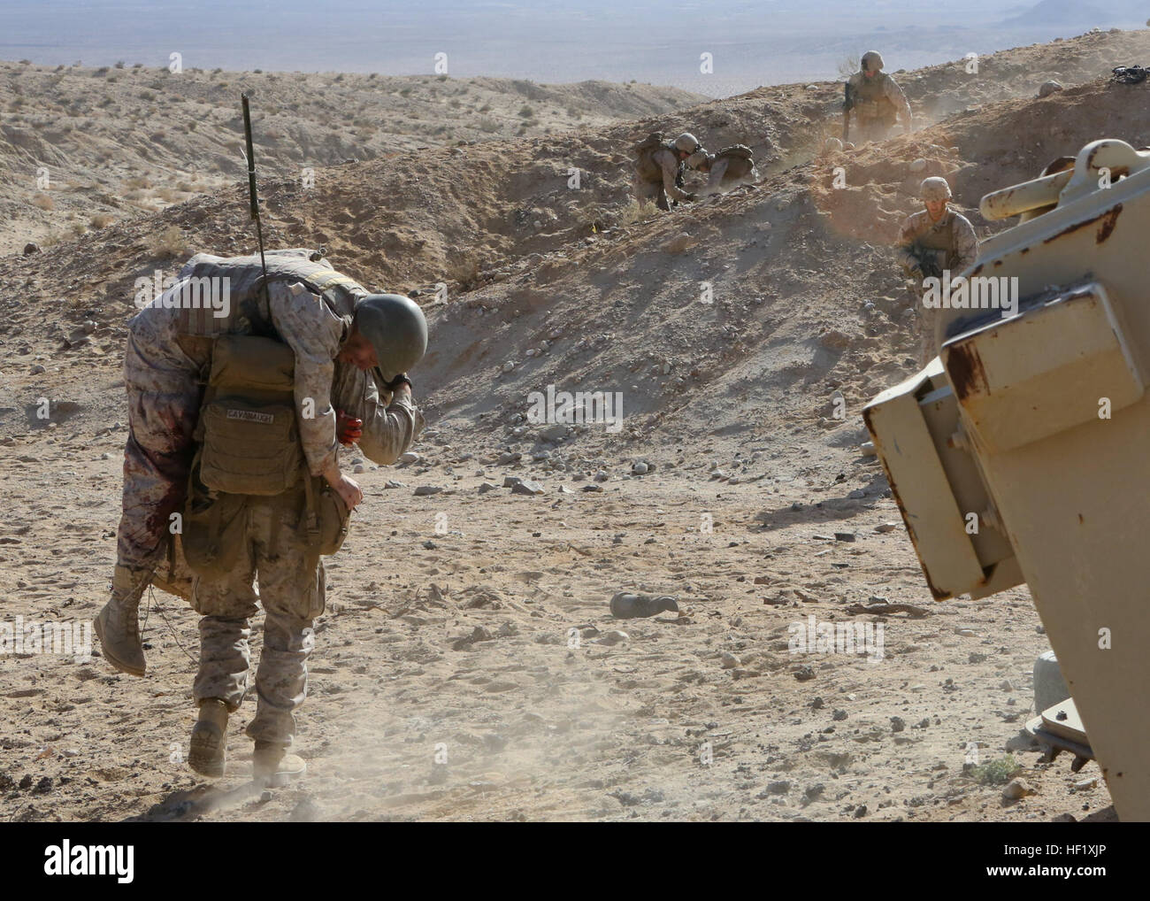 A U.S. Marine removes a casualty after a simulated Improvised Explosive ...