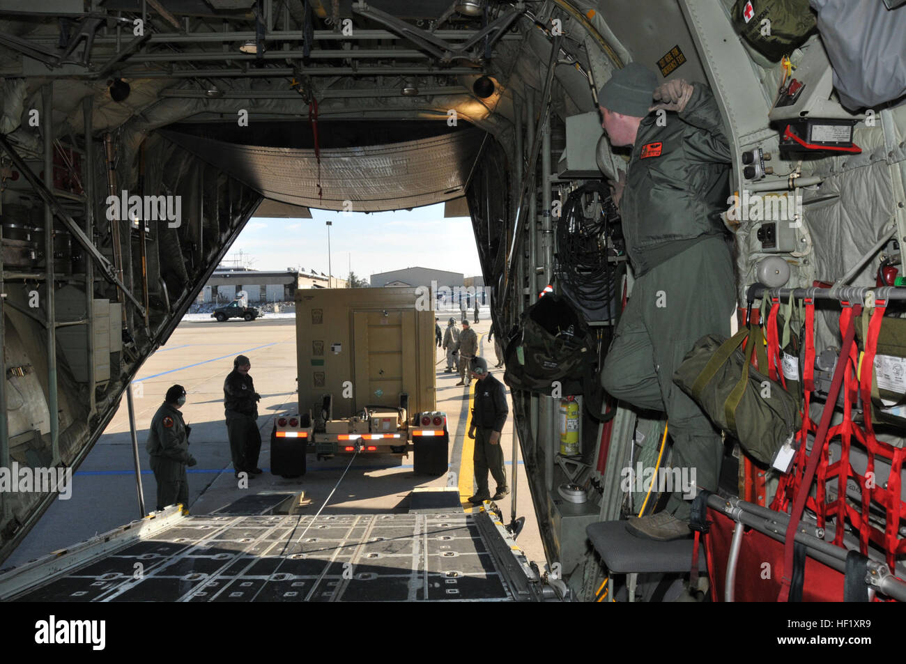 U.S. Air Force Airman 1st Class Seth Anderson (right), loadmaster from ...