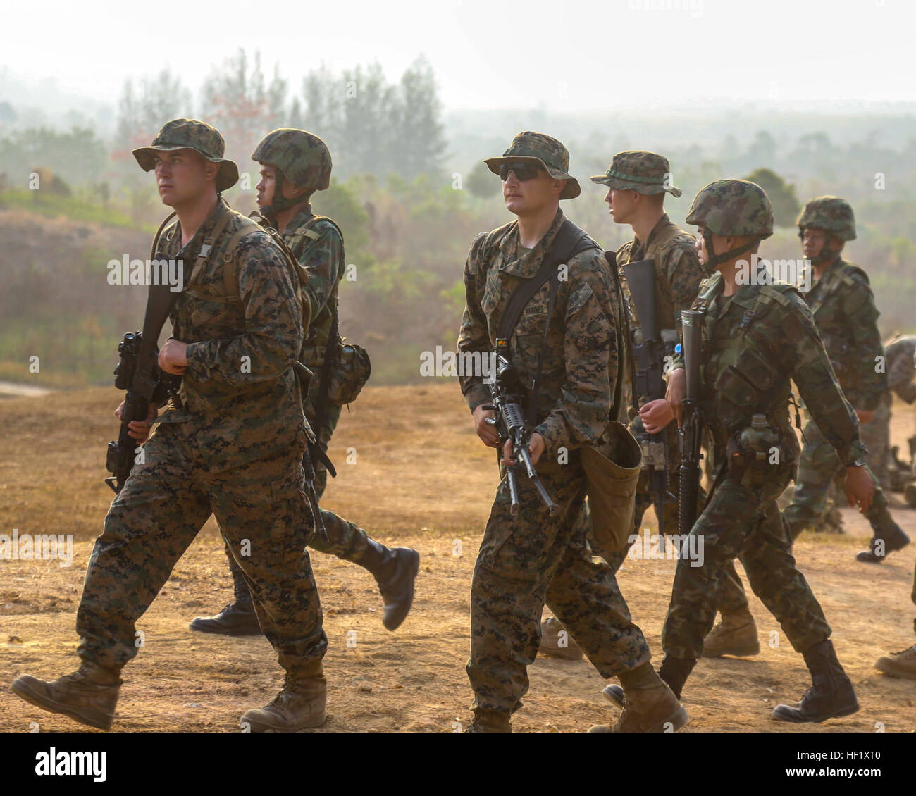 U.S. Marines and Royal Thai Marines make movement towards a battle ...