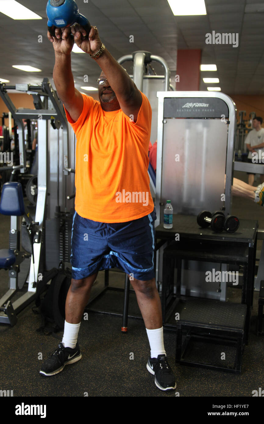 Retired Army Sgt. 1st Class Jimmy Tootle performs 20-pound kettle bell ...