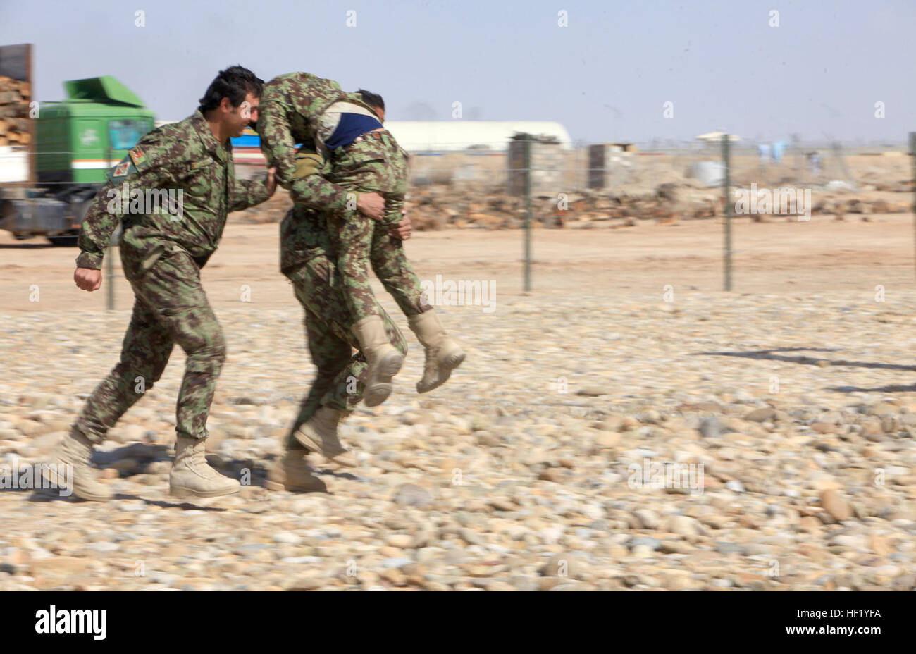 Afghan National Army soldiers with the 215th Corps perform a simulated ...