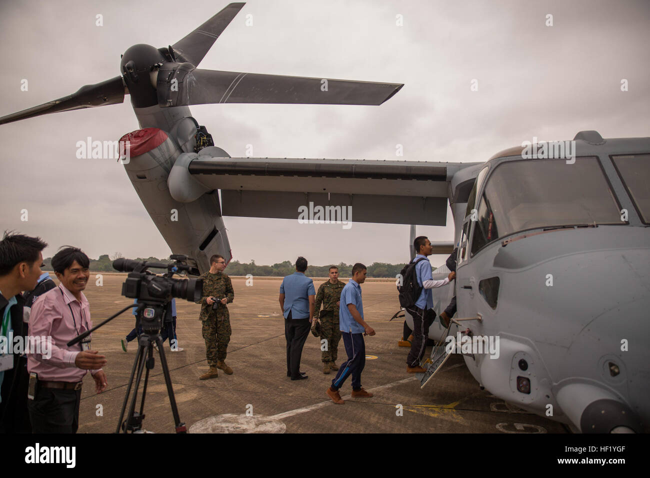 Thai children explore the inside of an MV-22B that is part of the ...
