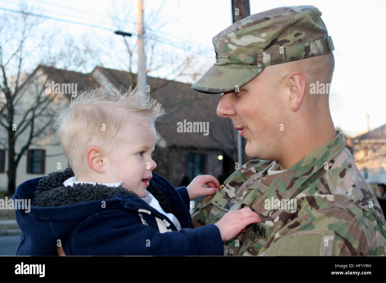 Sgt. Harry May is happy to hold his son, Tucker, for the first time ...