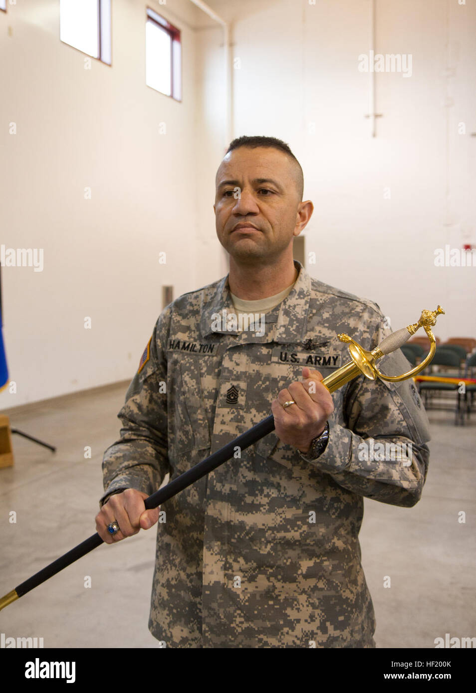 Incoming State Command Sgt. Maj Russell Hamilton holds the ceremonial ...