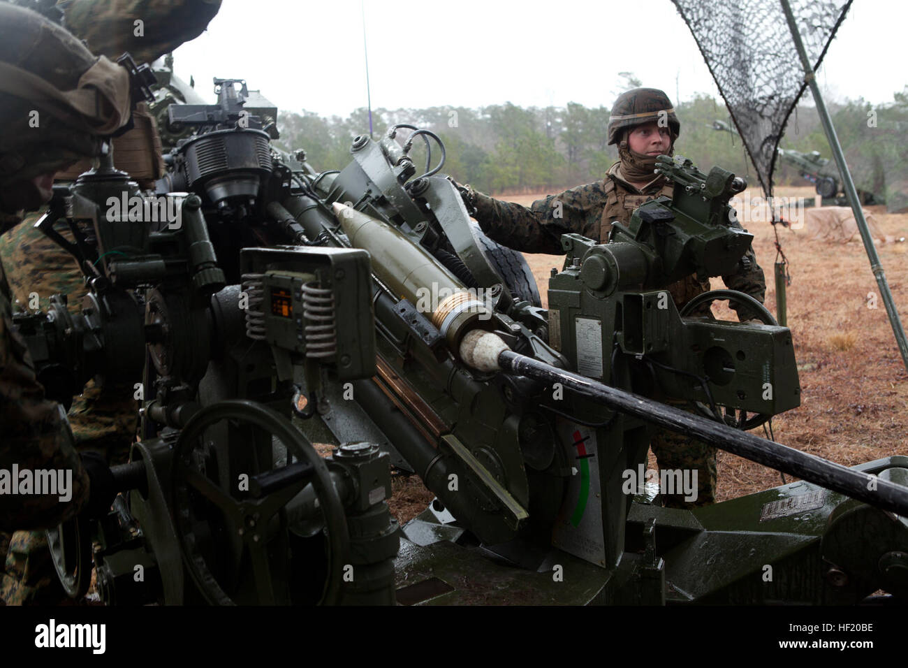 U.S. Marine Corps Cpl. Spencer Oneg, field artillery cannoneer, with ...