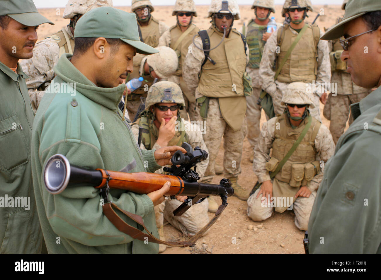 Marines from Weapons Company, 1st Battalion, 23rd Marines watch as ...