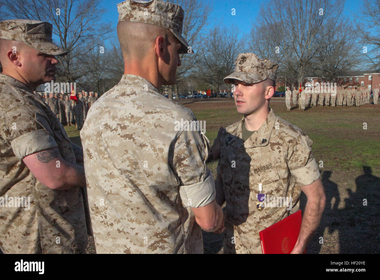 Lieutenant Col. John Osborne (middle) shakes hands with Sgt. Johnathan ...