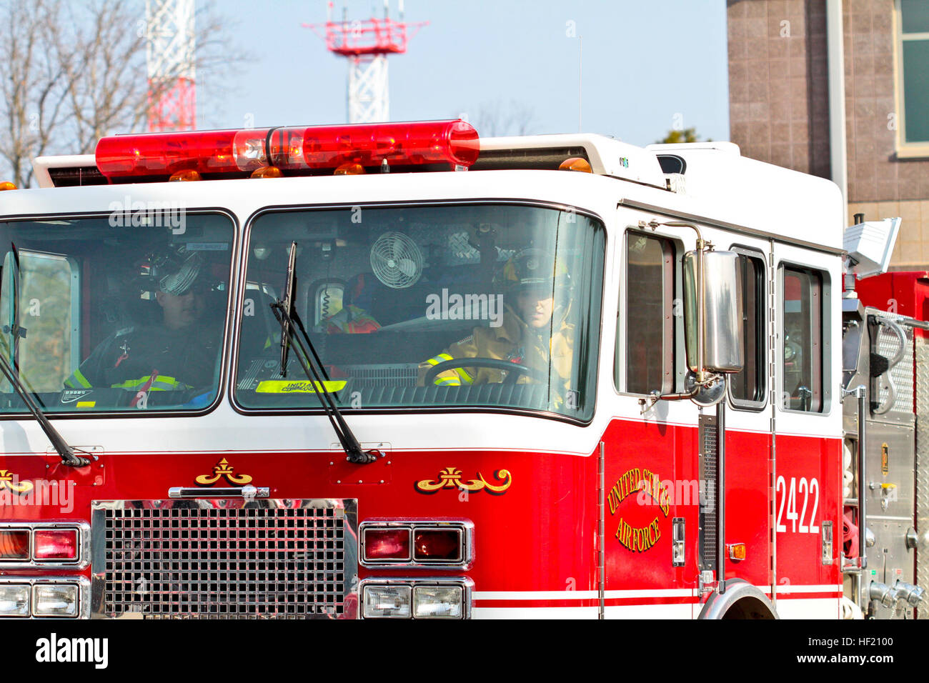 U.S. Air Force Airman 1st Class Litza De Jesus positions a fire engine ...