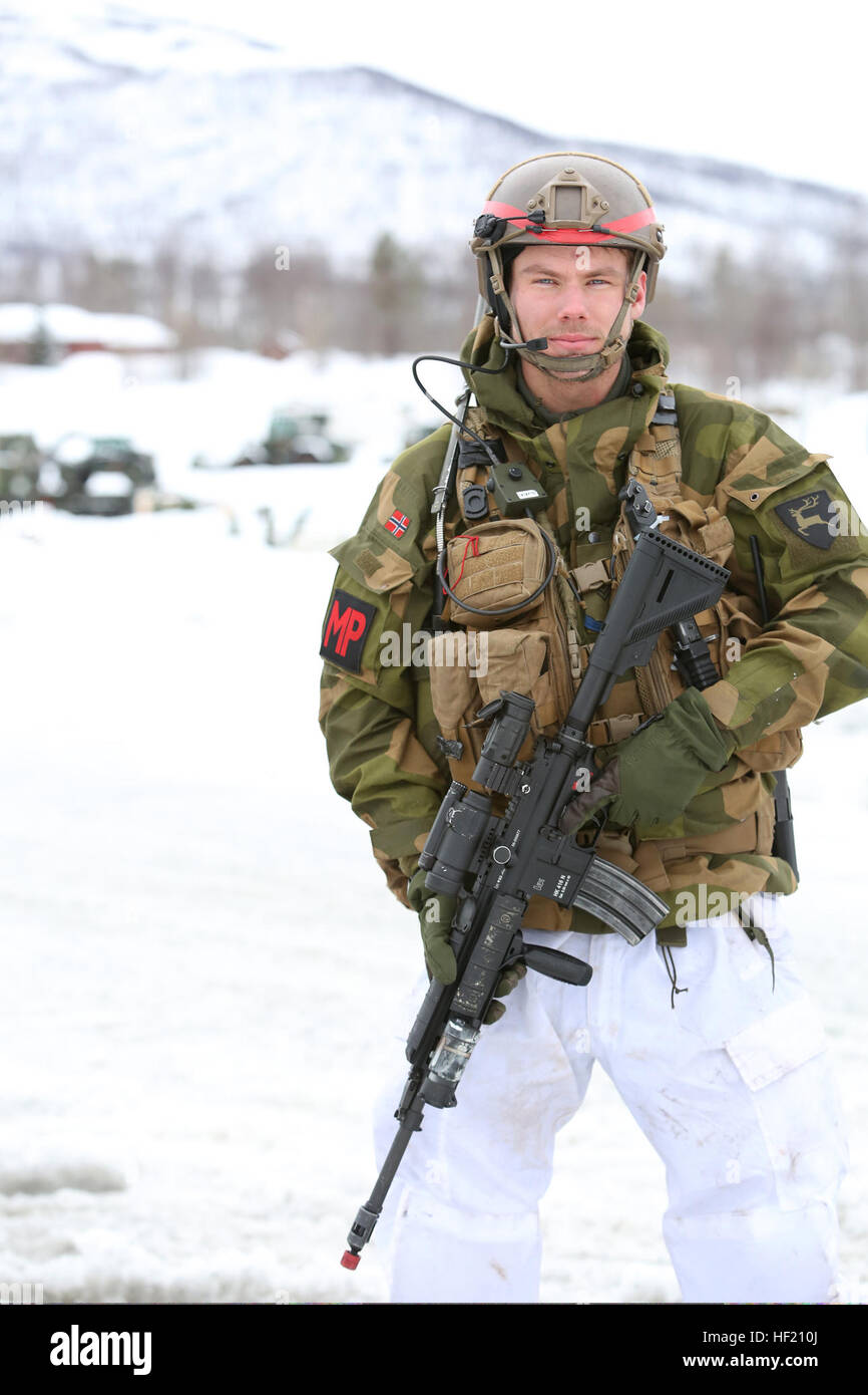 A Norwegian military police officer stands guard during a live-fire ...
