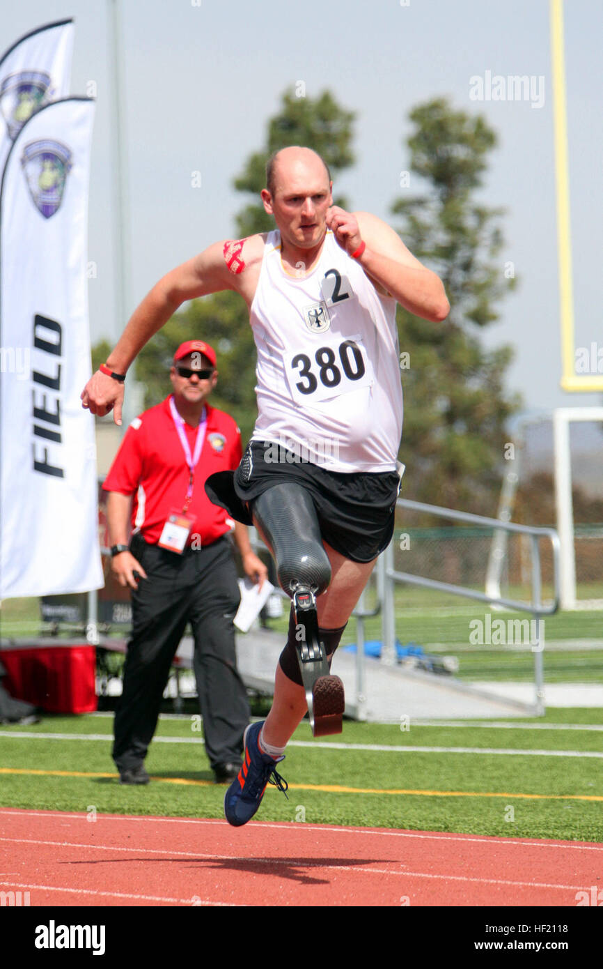 Germany's Sgt. Robert Krop competes in the 100 meter dash at the 2014 ...