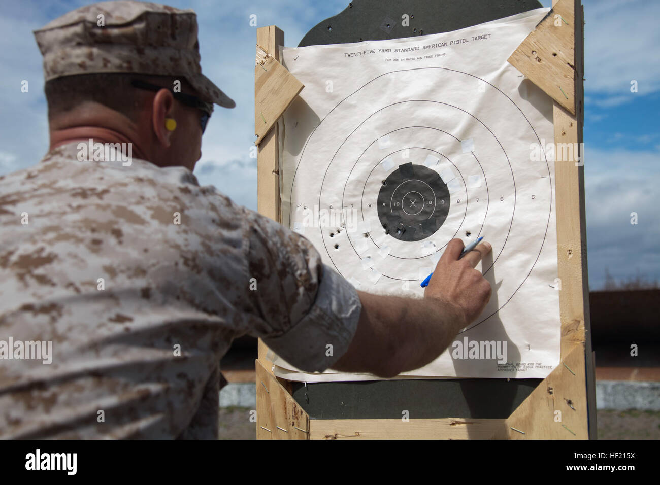 A Marine section leader scores a target during the 2014 Intramural ...
