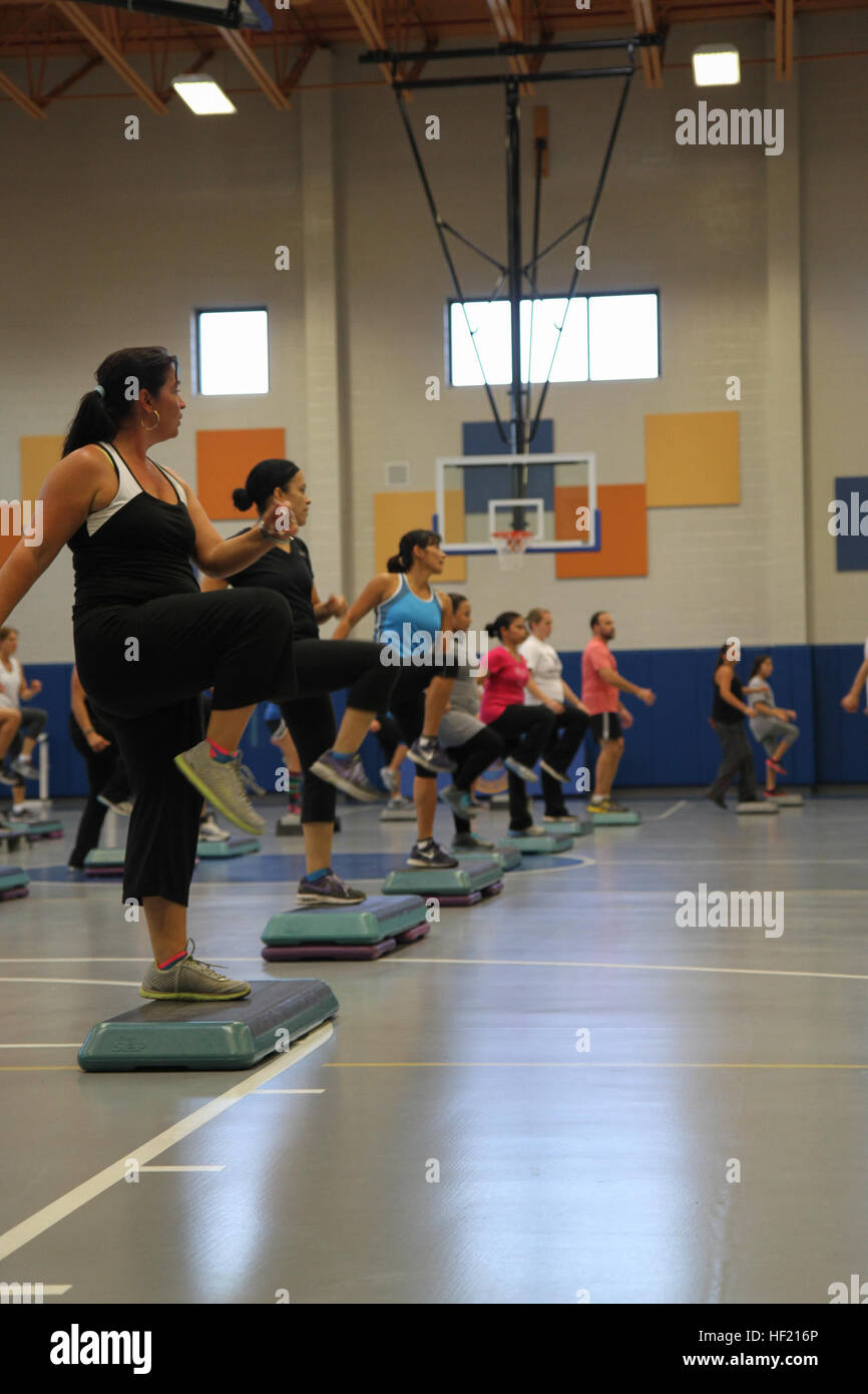 MWR patrons enjoy the fast paced exercise of the step aerobics class ...