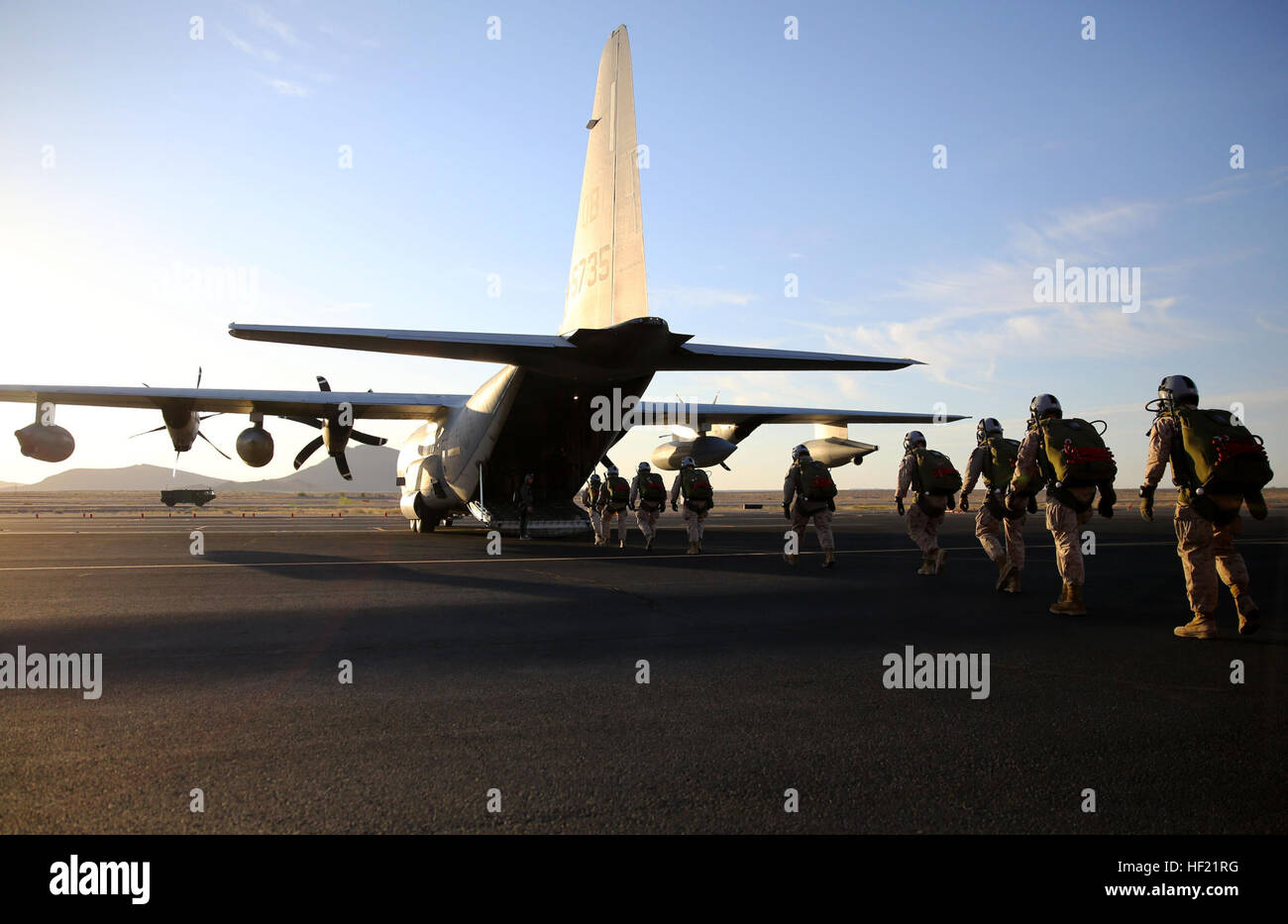 Marines with Bravo Company, 1st Reconnaissance Battalion, board a C-130 ...