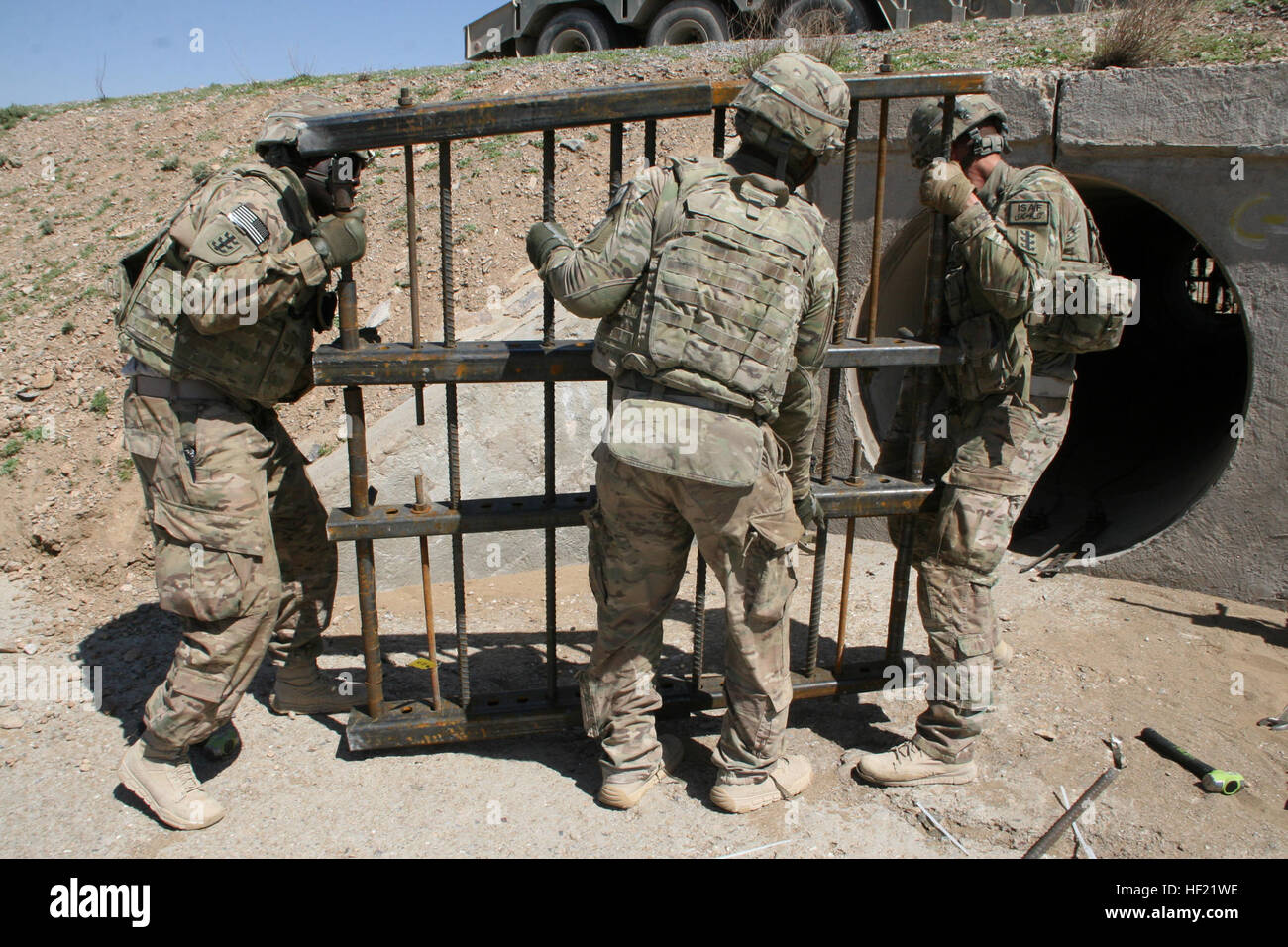 U.S. Army soldiers with the 65th Engineer Battalion install culvert ...