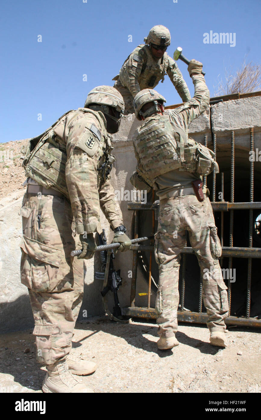 U.S. Army soldiers with the 65th Engineer Battalion install culvert ...