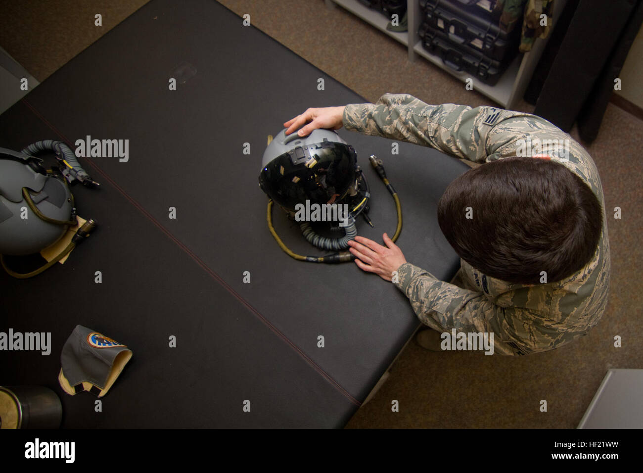 U.S. Air Force Senior Airman Eric Halladay inspects an F-16 Fighting ...