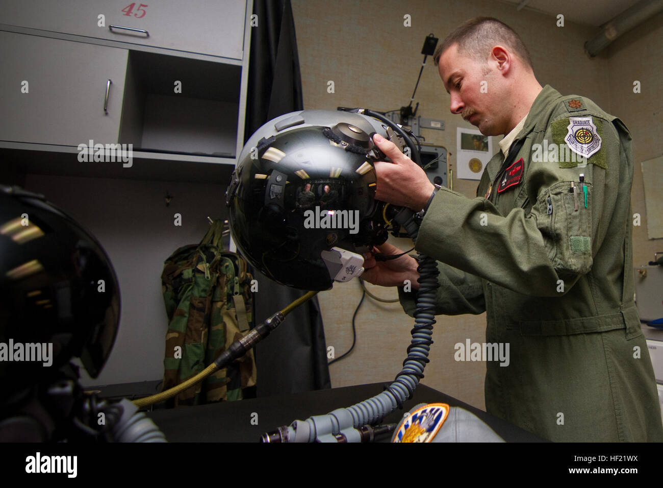 U.S. Air Force Maj. Jason Halvorsen inspects his helmet with the Helmet ...