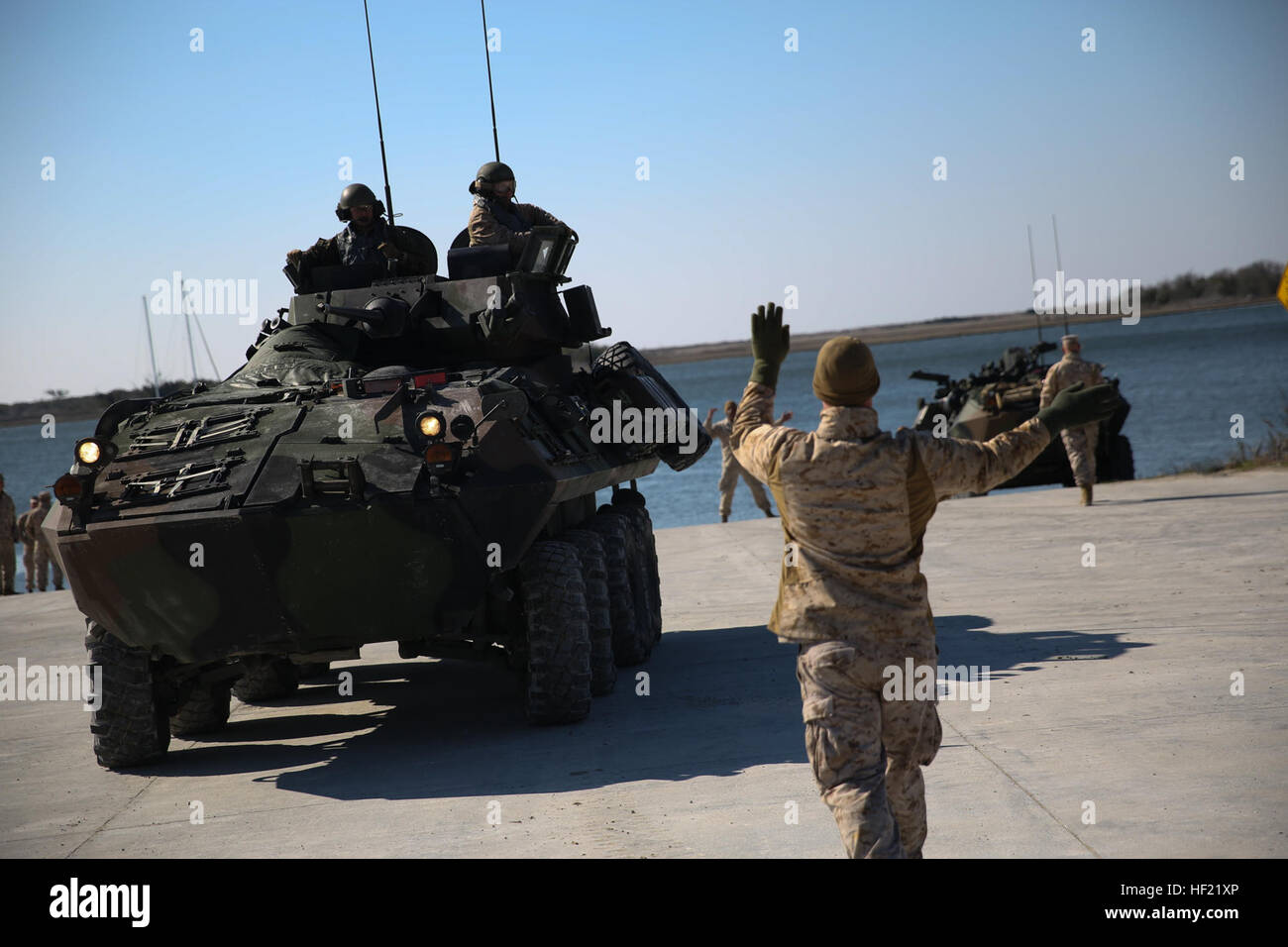 2nd Light Armored Reconnaissance Battalion Marines signal the Light ...