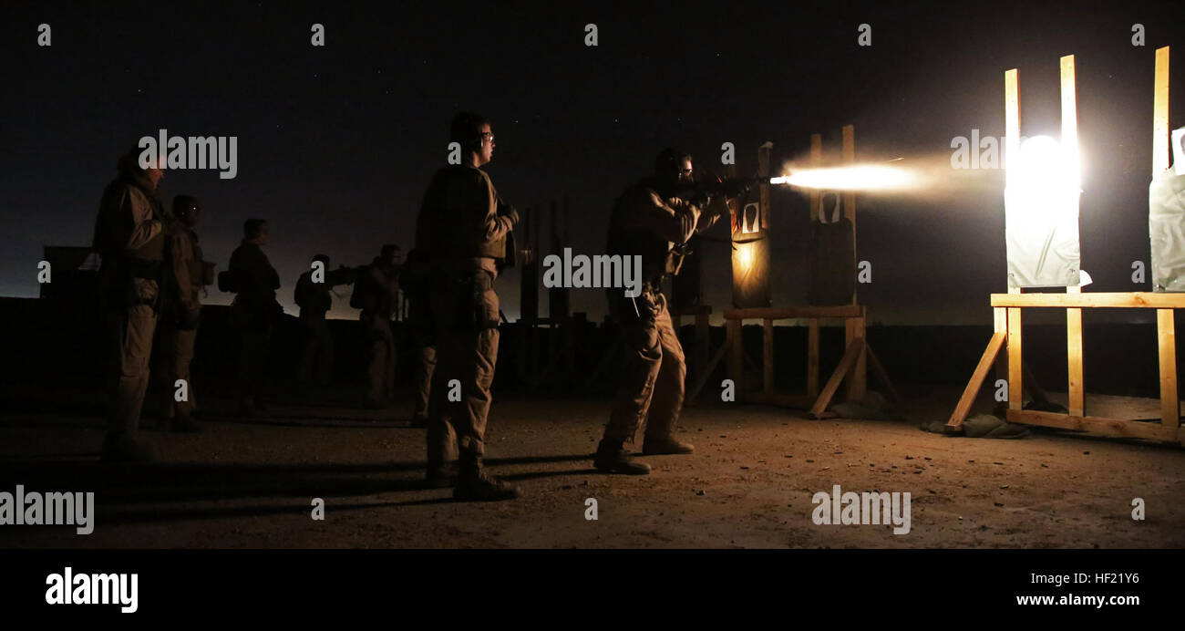 Corporal Eric J. Harris, a Special Reaction Team marksman observer the ...