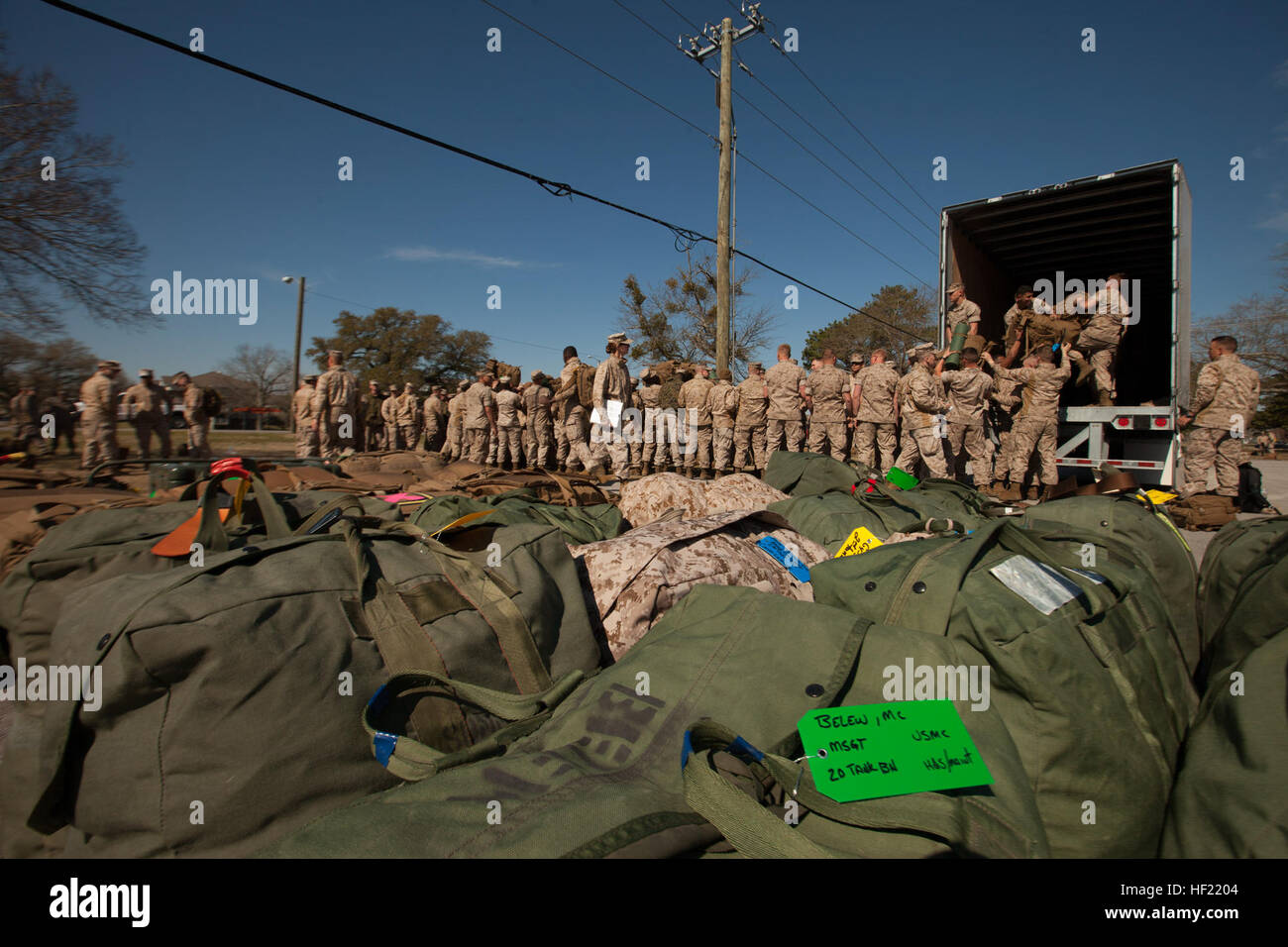 U.S. Marines with 2nd Tank Battalion, 2nd Marine Division, load gear ...