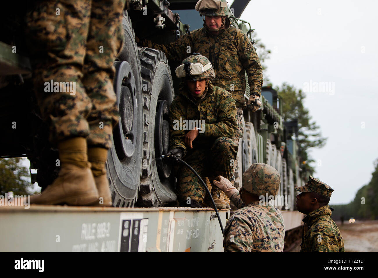U.S. Marines with 2nd Tank Battalion, 2nd Marine Division, inflate a ...