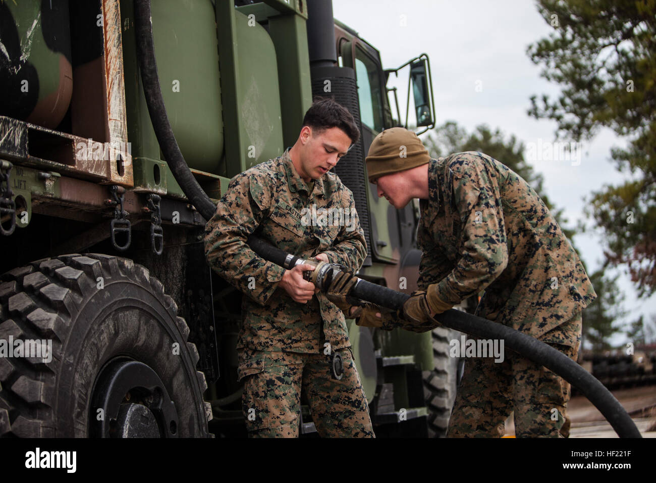 U.S. Marine Corps Lance Cpl. Kyle Caster (left), heavy section ...