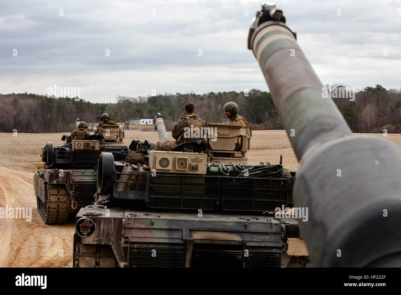 U.S. Marine Corps M1A1 Abrams tanks roll out from the railhead to the ...