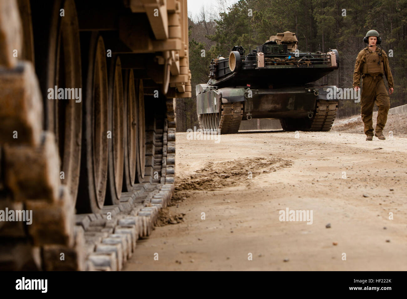 A Marine Corps gunner guides an M1A1 Abrams tank during a Deployment ...