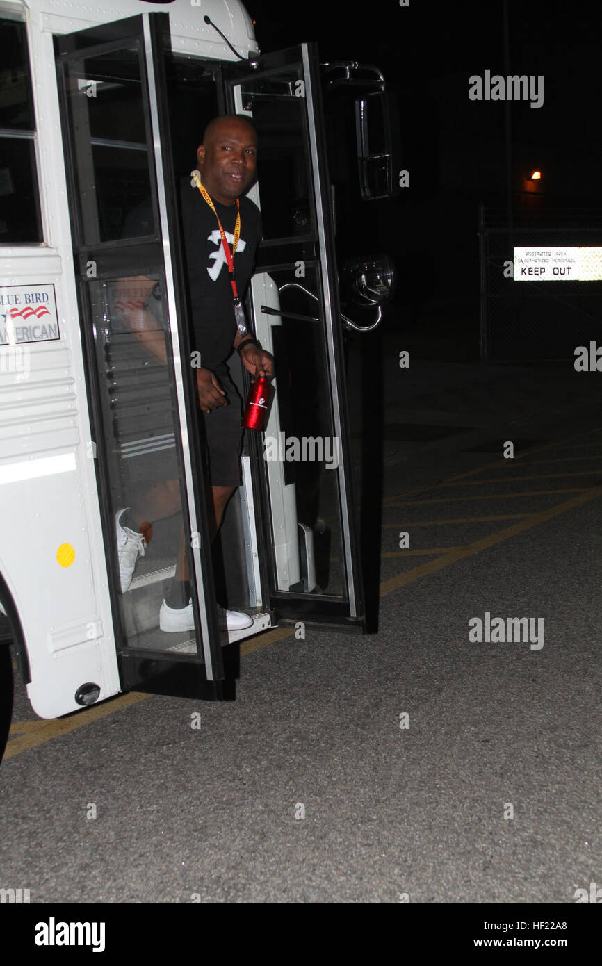 Victor Holman, an English teacher at Franklin High School in Canton, Mich., hurries off a bus to ...