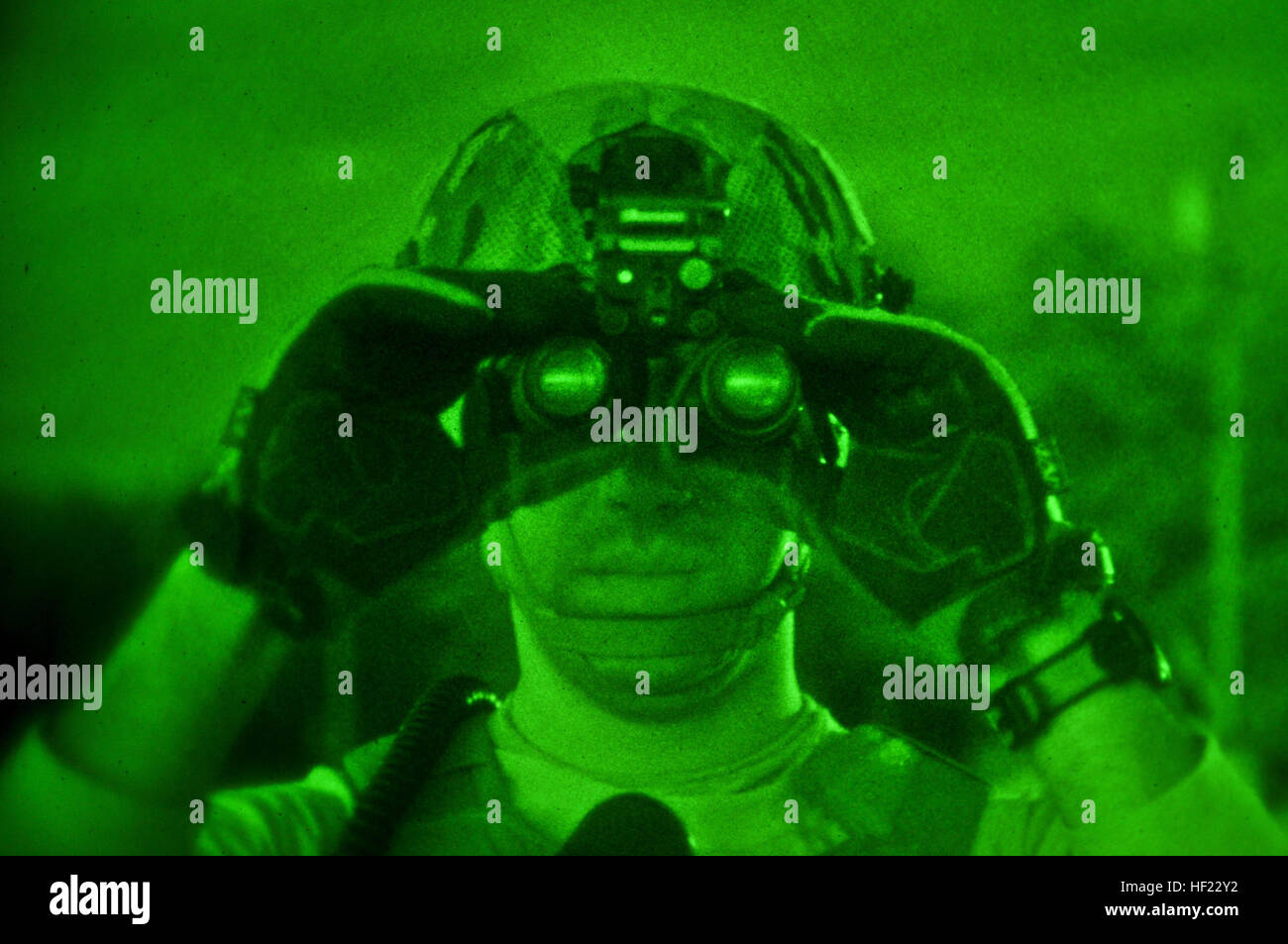 U.S. Air Force 1st Lt. Andrew Bruno adjusts his night vision goggles on ...
