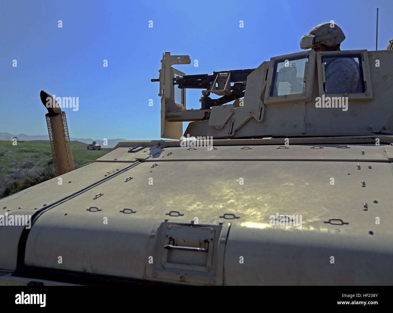 A Marine on a High Mobility Multipurpose Wheeled Vehicle with Combat ...