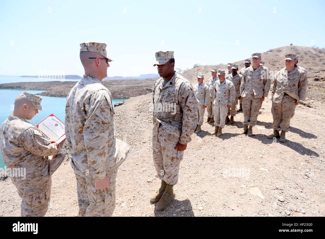 U.S. Marine Corps Gunnery Sgt. Eugene Moye, center, 22nd Marine ...