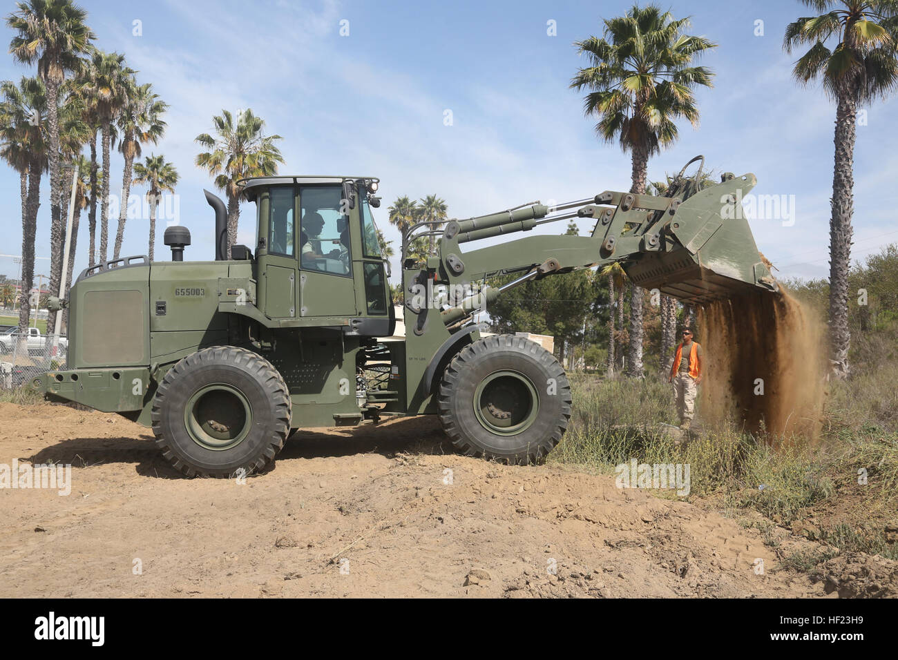 A U.S. Marine with 1st Combat Engineer Battalion operates a 624KR ...