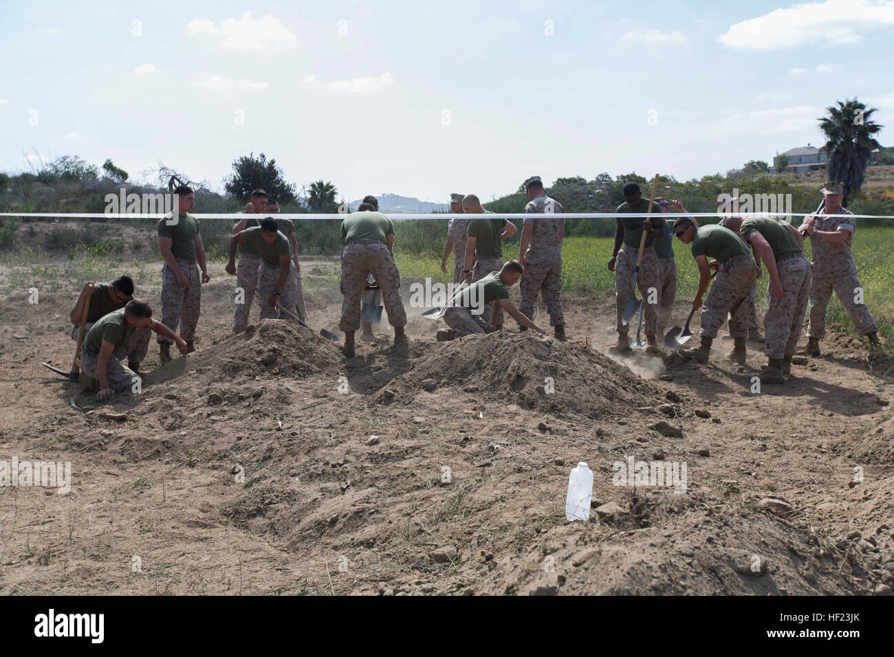 U.S. Marines with 1st Combat Engineer Battalion move dirt to build a ...