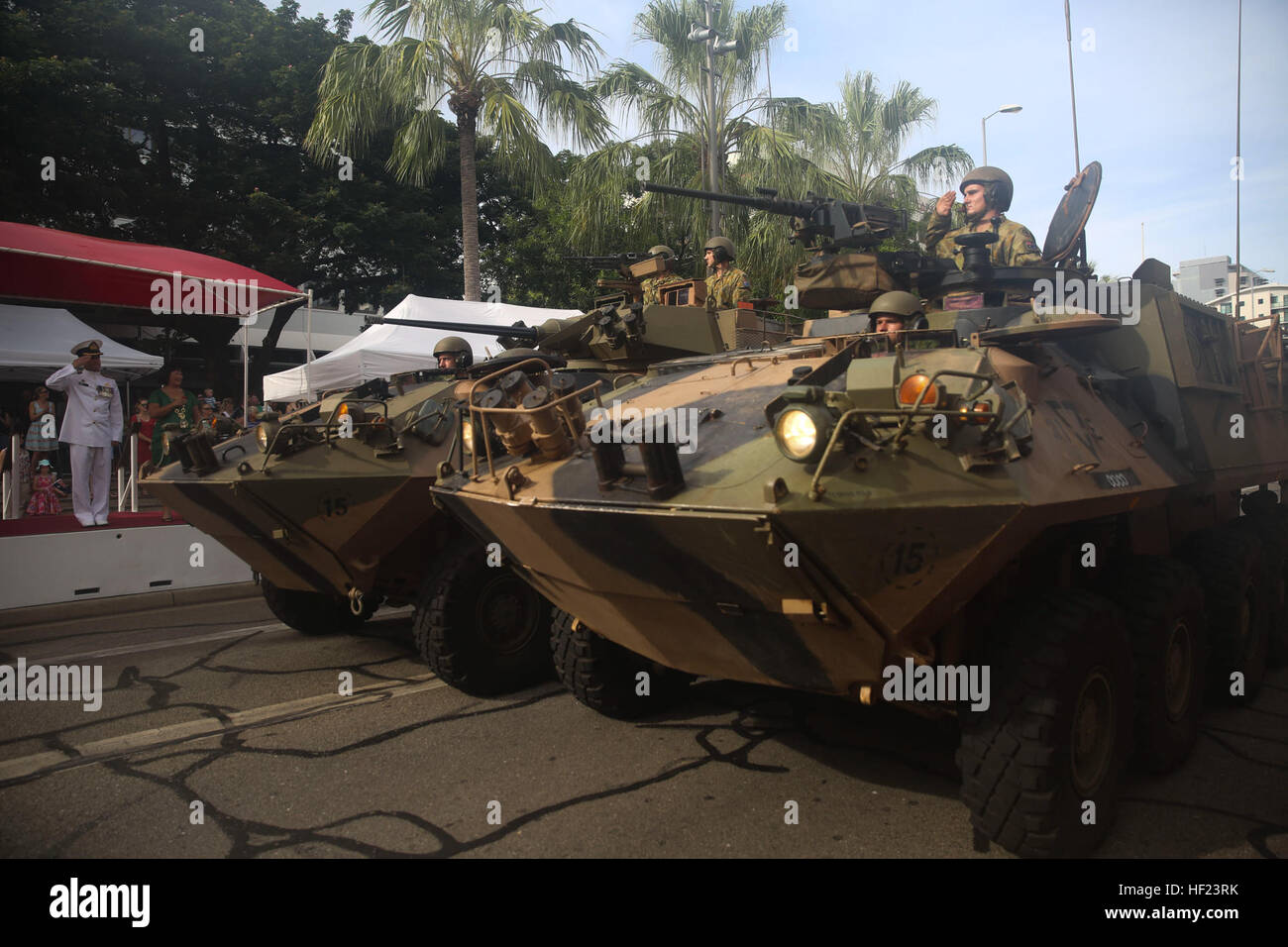 Soldiers with 1st Brigade, Australian Army, salute from light armored ...