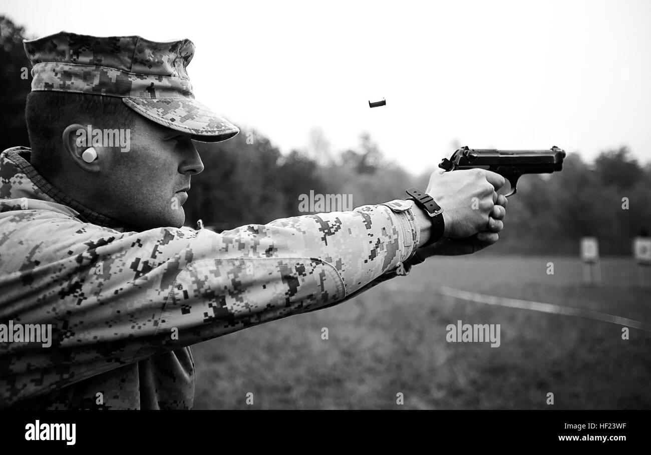 2nd Lt. Michael Flanagan fires the Beretta M9 during a live-fire course ...