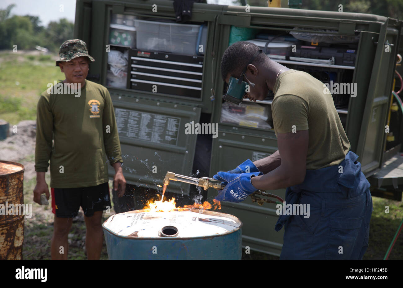 U.S. Marine Corps Lance Cpl. Nyeme M. Baker, a metal worker attached to ...