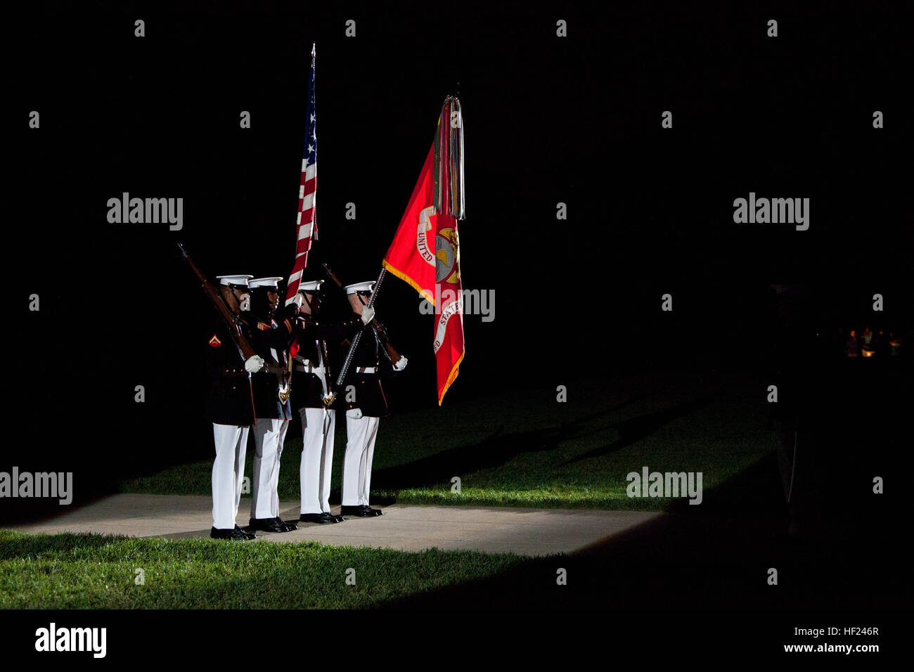 Members of a U.S. Marine Corps color guard present the colors during an ...