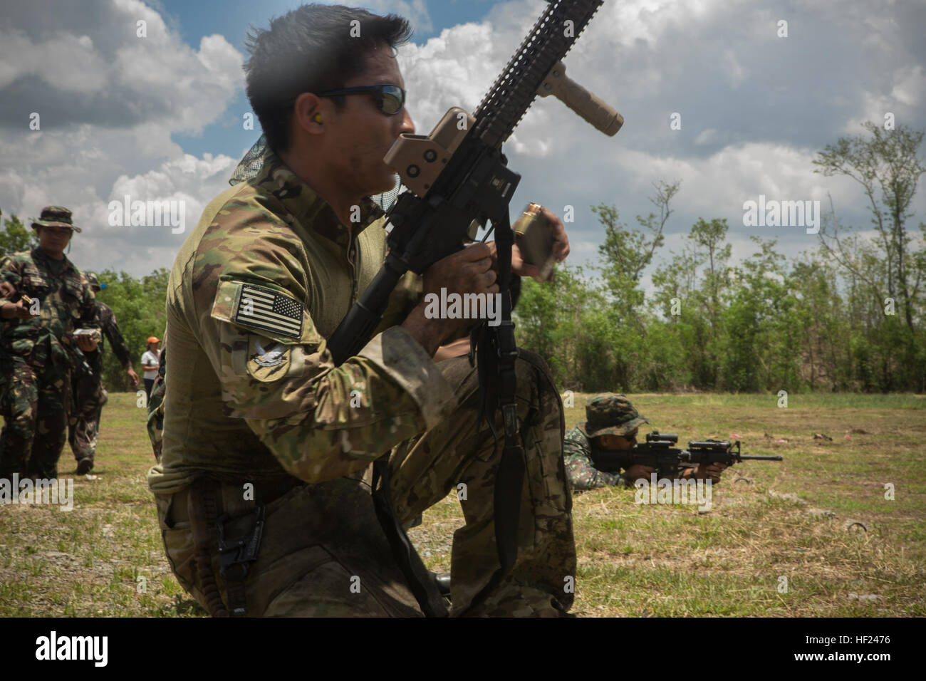 A U.S. Special Operations Forces Soldier joins a Philippine SOF soldier ...