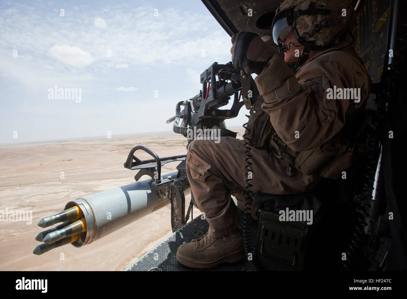 Corporal Andrew Harris, a UH-1Y Huey crew chief with Marine Light ...