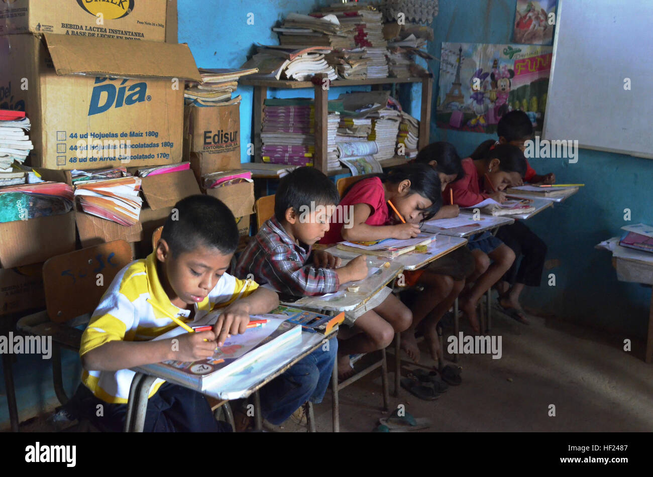 A group of Guatemalan school children attend school in their current ...