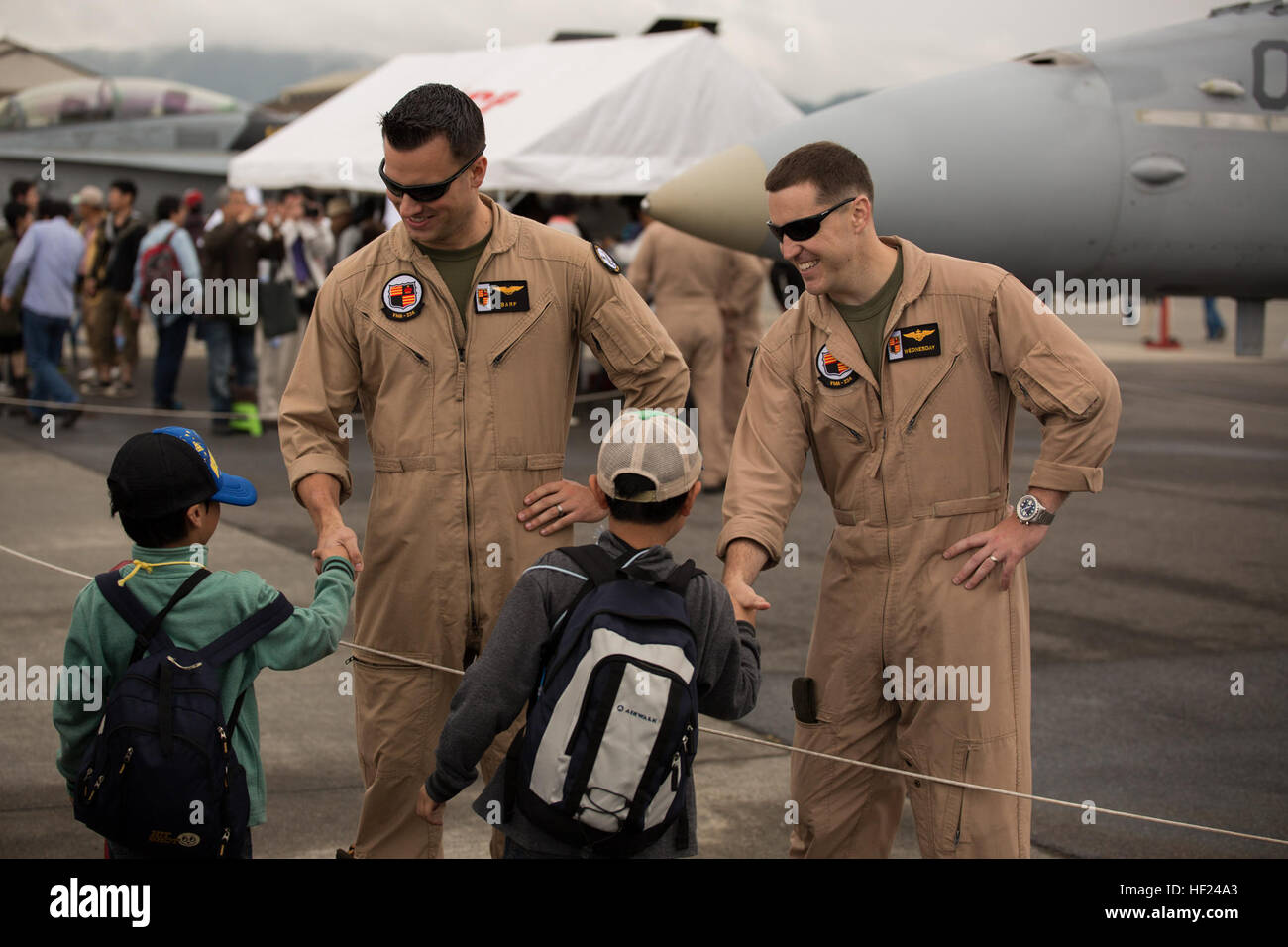 Capt. Brian Hall, left, and Capt. Ted Lindell, right, shake hands with ...