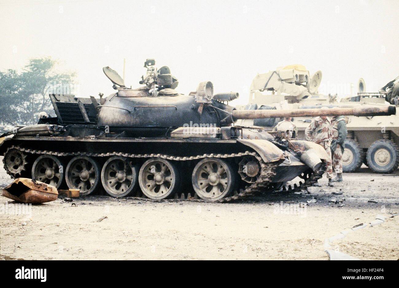 Marines inspect an Iraqi Type 69-II main battle tank damaged during ...